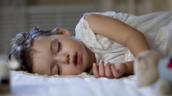 child coughing while sleeping